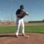 With a runner on base the pitcher drops the ball. - Baseball Rules Academy